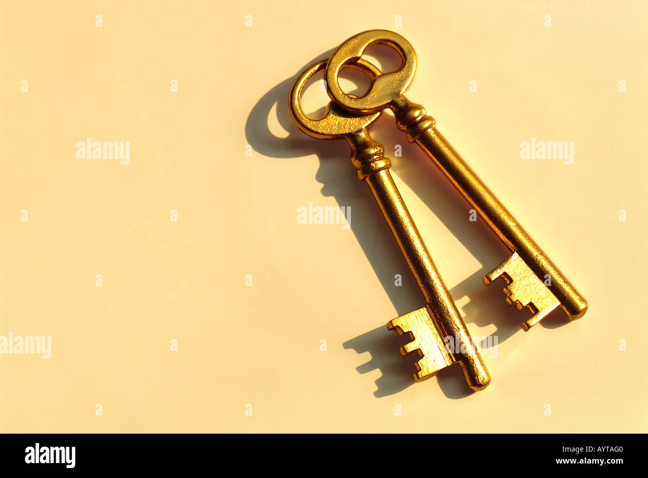 Two old fashioned golden keys Stock Photo - Alamy