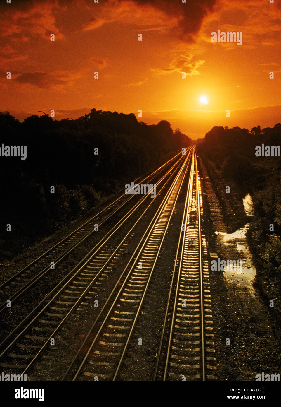 Railway tracks at sunset Stock Photo - Alamy