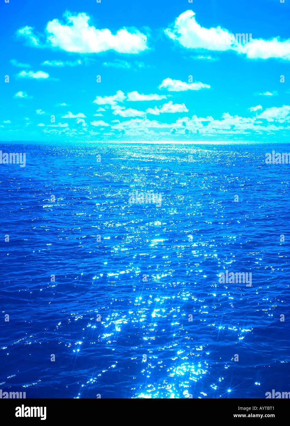 The sparkling blue ocean under a clear sky Stock Photo - Alamy