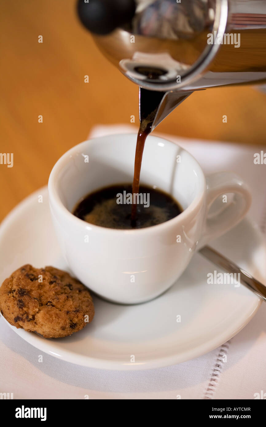 Coffee flowing in a cup Stock Photo - Alamy