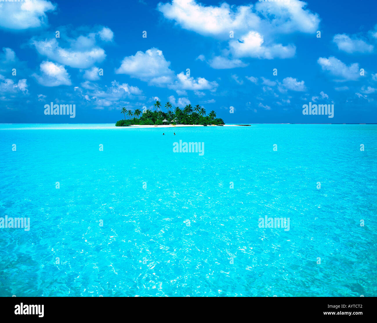 Crystal blue ocean with an island in the distance Stock Photo - Alamy