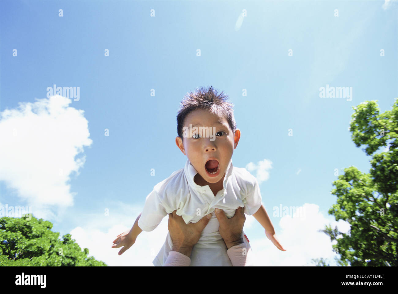 astonished boy thrown in the air Stock Photo - Alamy