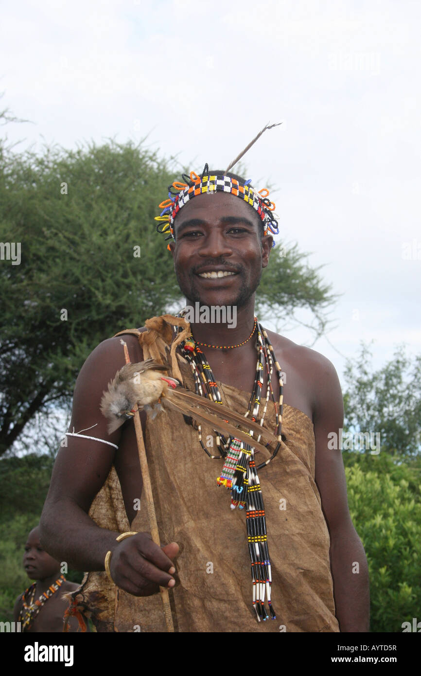 Africa Tanzania Lake Eyasi Hadza male with a bird spiked on an arrow ...