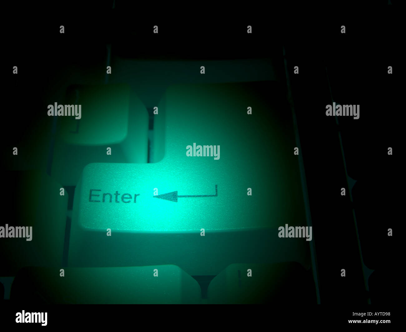 Black Enter Key on Keyboard with teal light effect Stock Photo - Alamy
