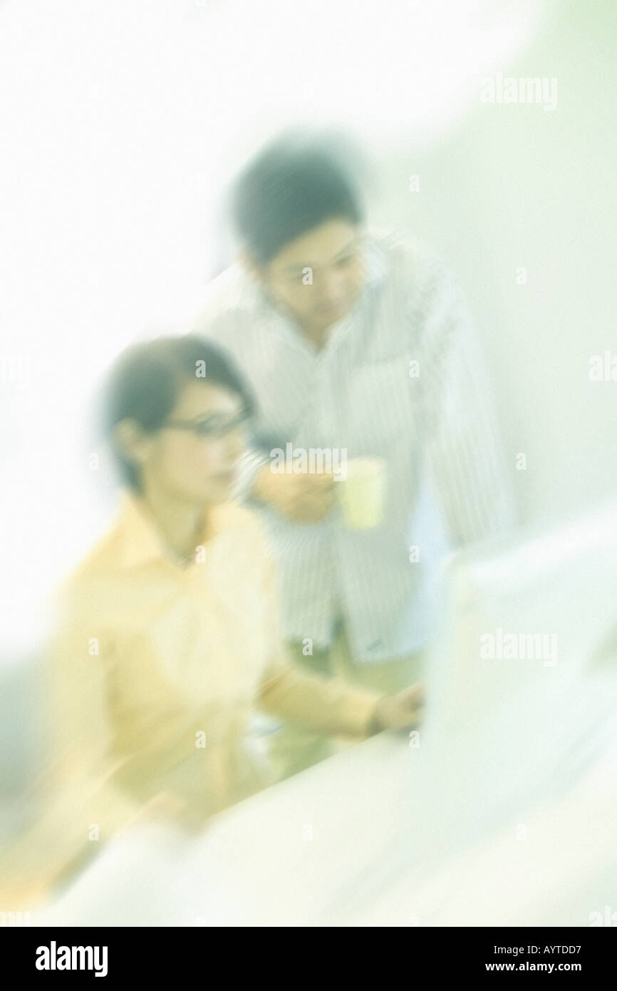 Man and woman with computer Stock Photo - Alamy
