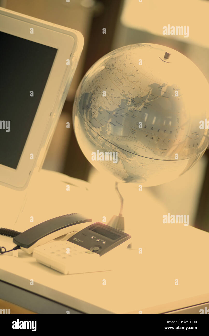 Office interior with computer and globe Stock Photo - Alamy