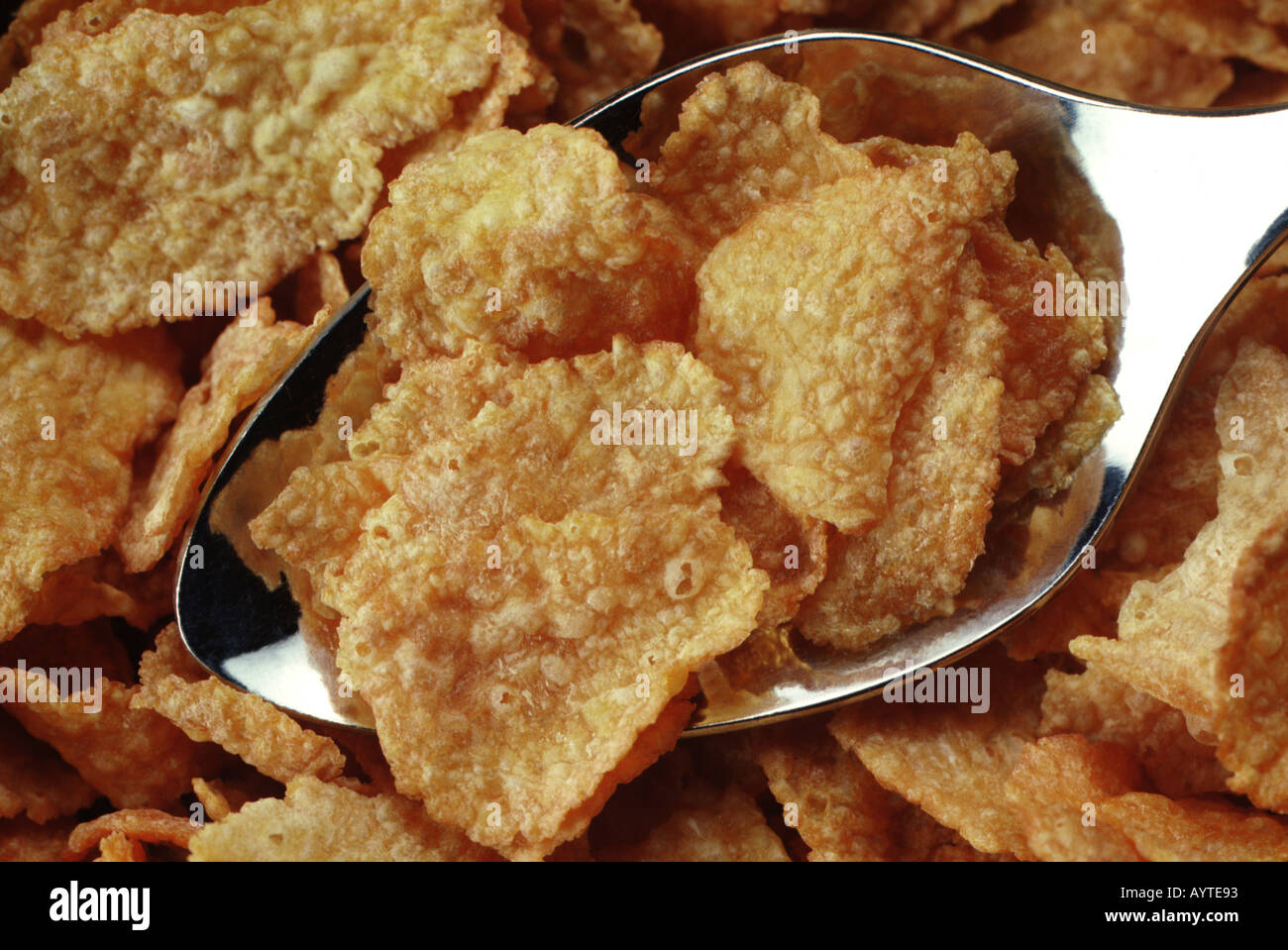 Corn flakes cereal and spoon close up Stock Photo - Alamy