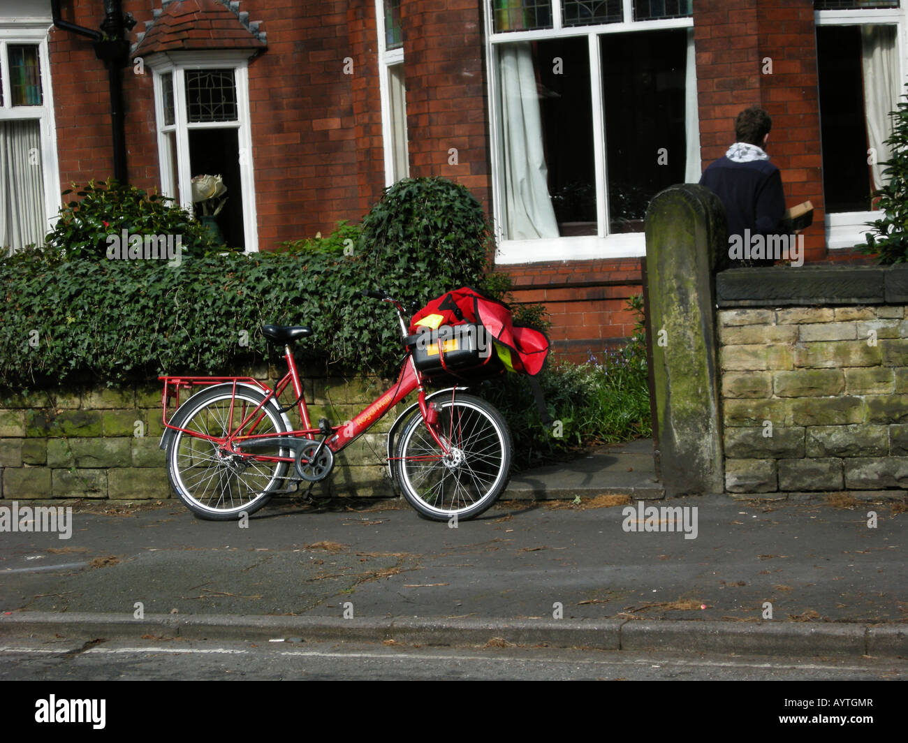 postman delivering mail Stock Photo - Alamy
