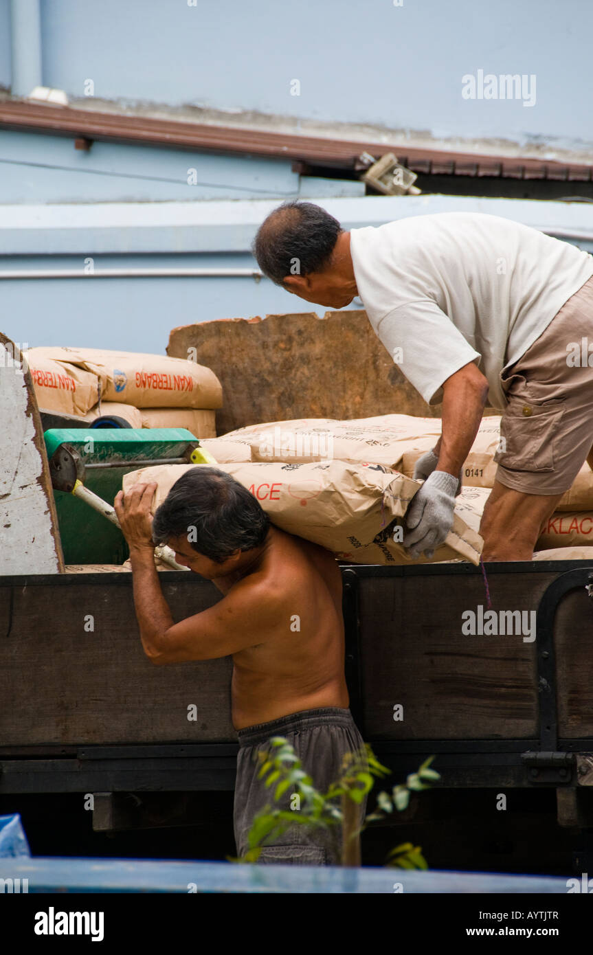 Indian labourers working in Little India Singapore Stock Photo - Alamy