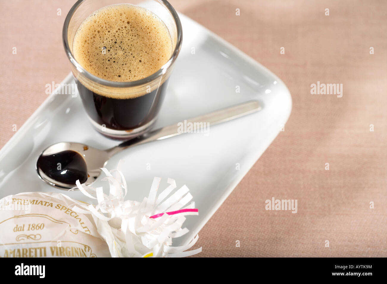 A glass of Coffee and a teaspoon Stock Photo - Alamy