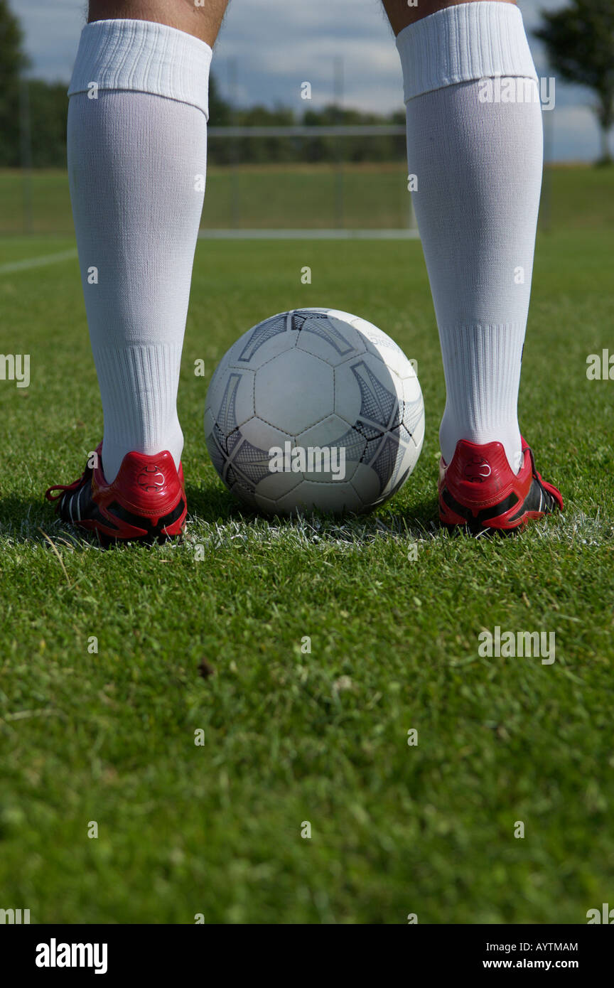 Ball between kicker's feet Stock Photo - Alamy