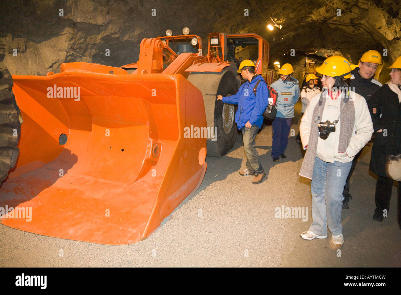 Visitors in the LKAB InfoMine at Kiruna/Sweden looking at a front ...