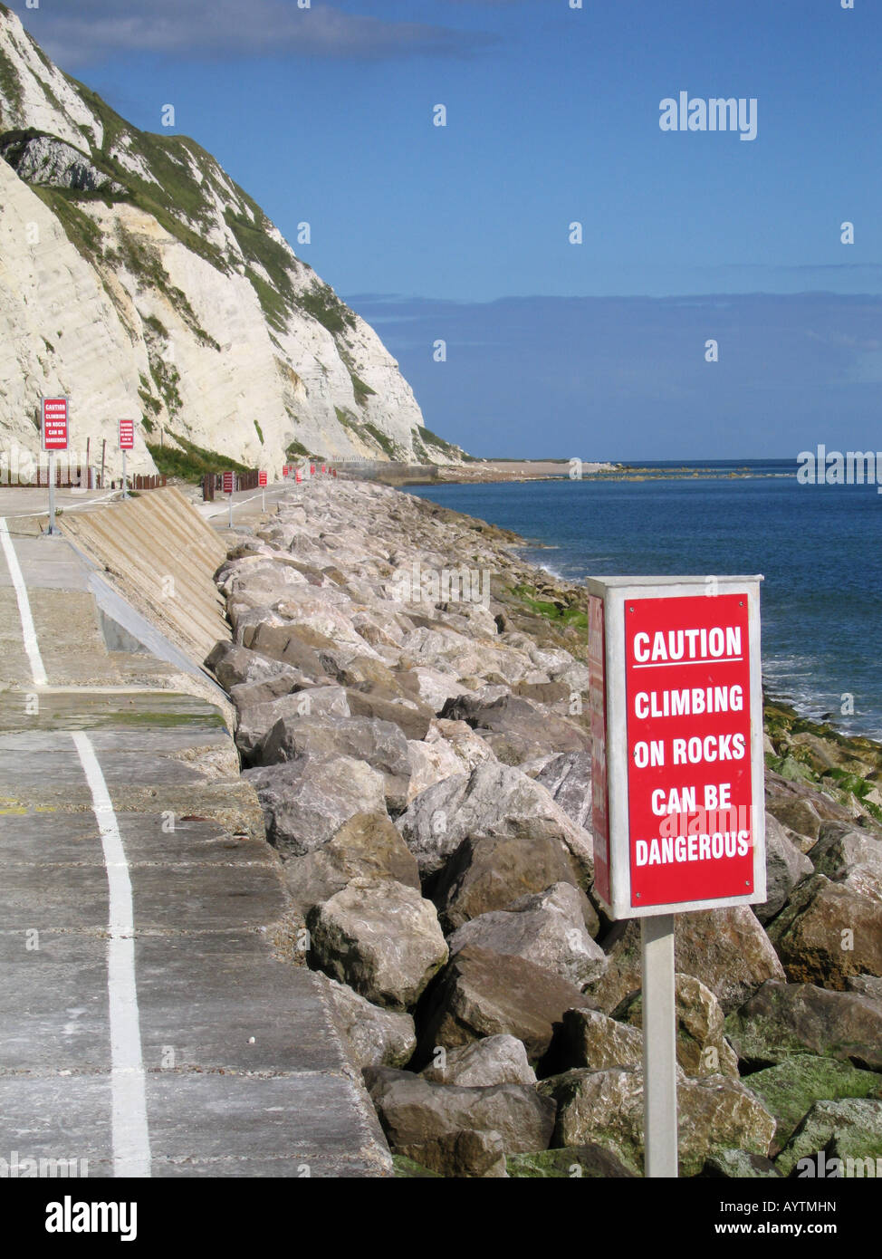 Chalk cliffs and warning sign Abotts Cliff Folkestone Kent England UK ...
