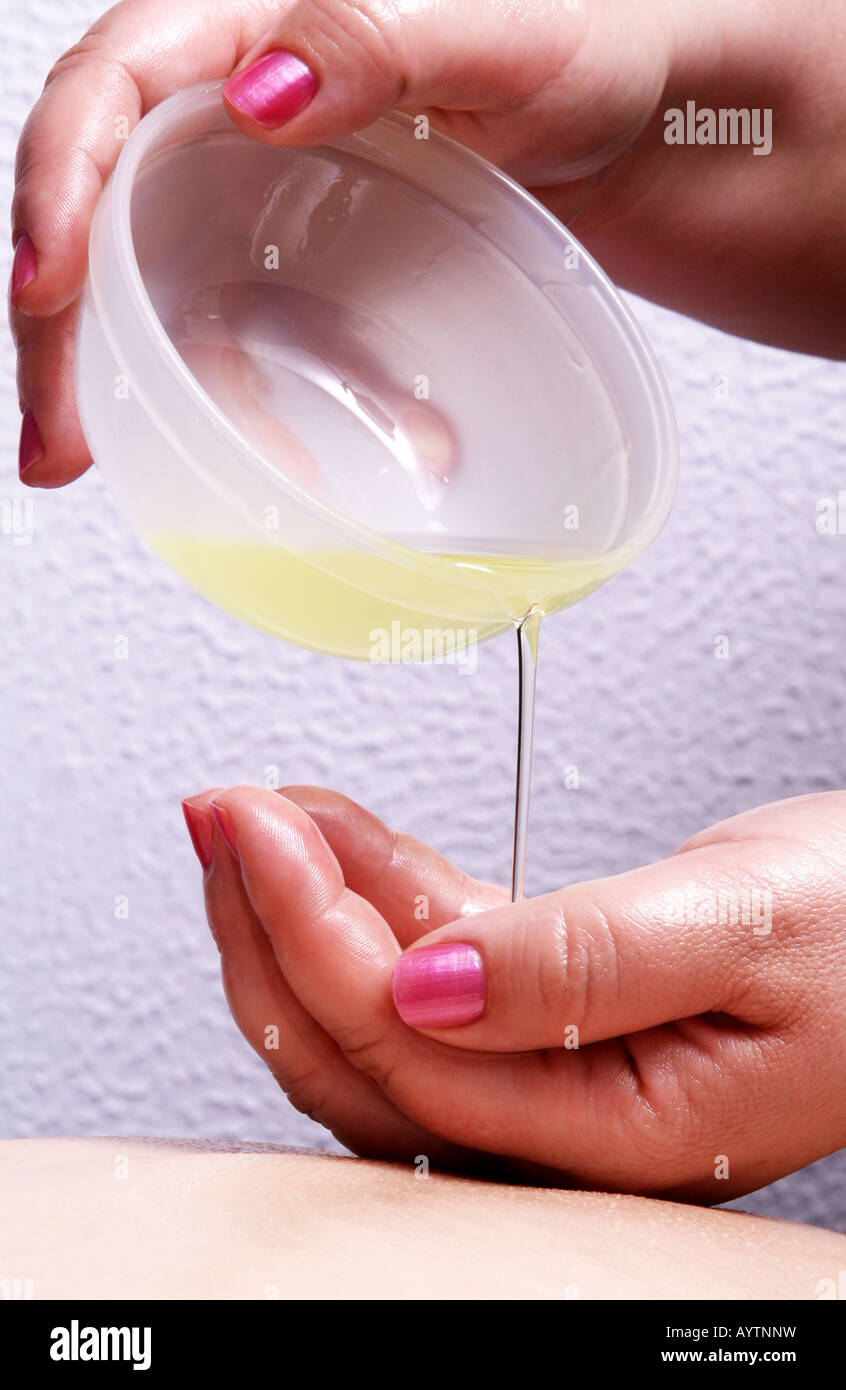 Massage oil being prepared for spa treatment Stock Photo - Alamy