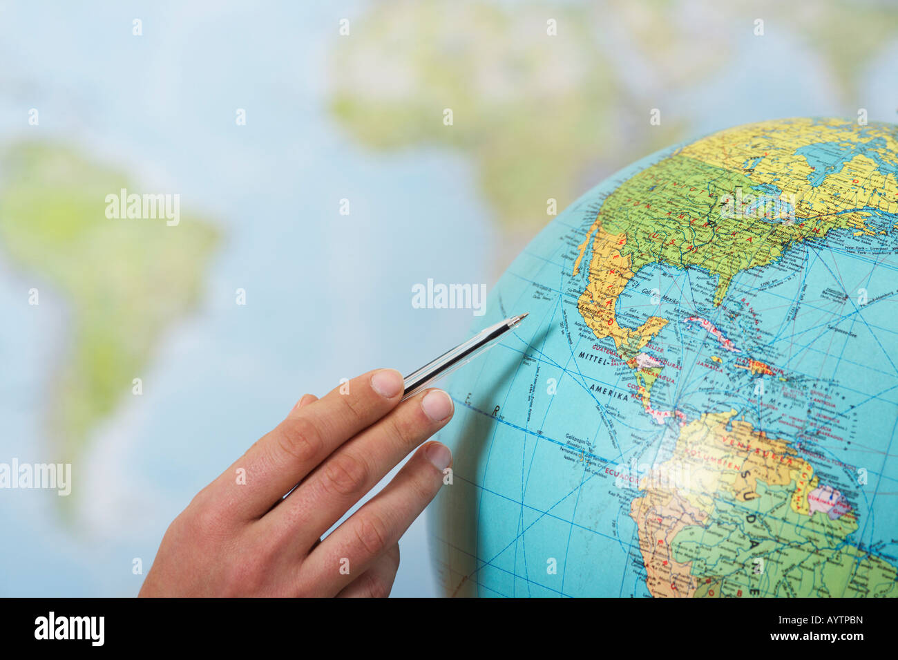 Pointing with a pencil on a world map Stock Photo - Alamy