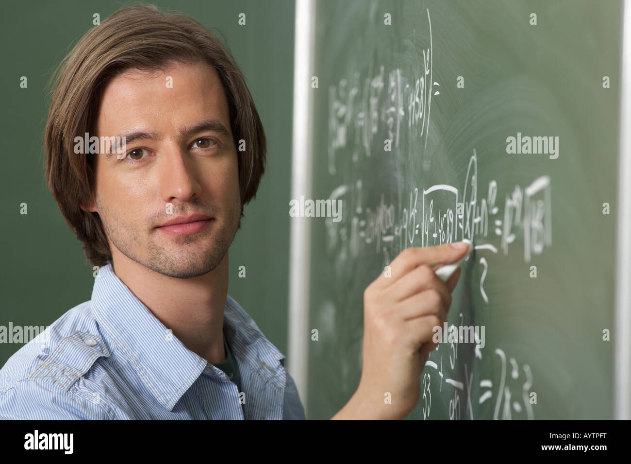 Man is reading prims on a board Stock Photo - Alamy