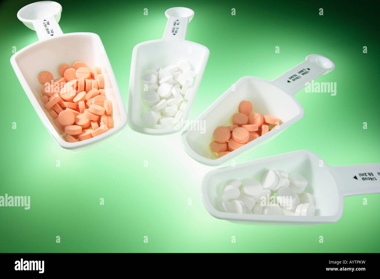 Measuring Spoons with Tablets Stock Photo - Alamy