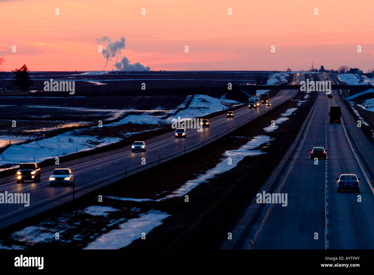 Cars and trucks stream down the interstate in rural northern Illinois ...