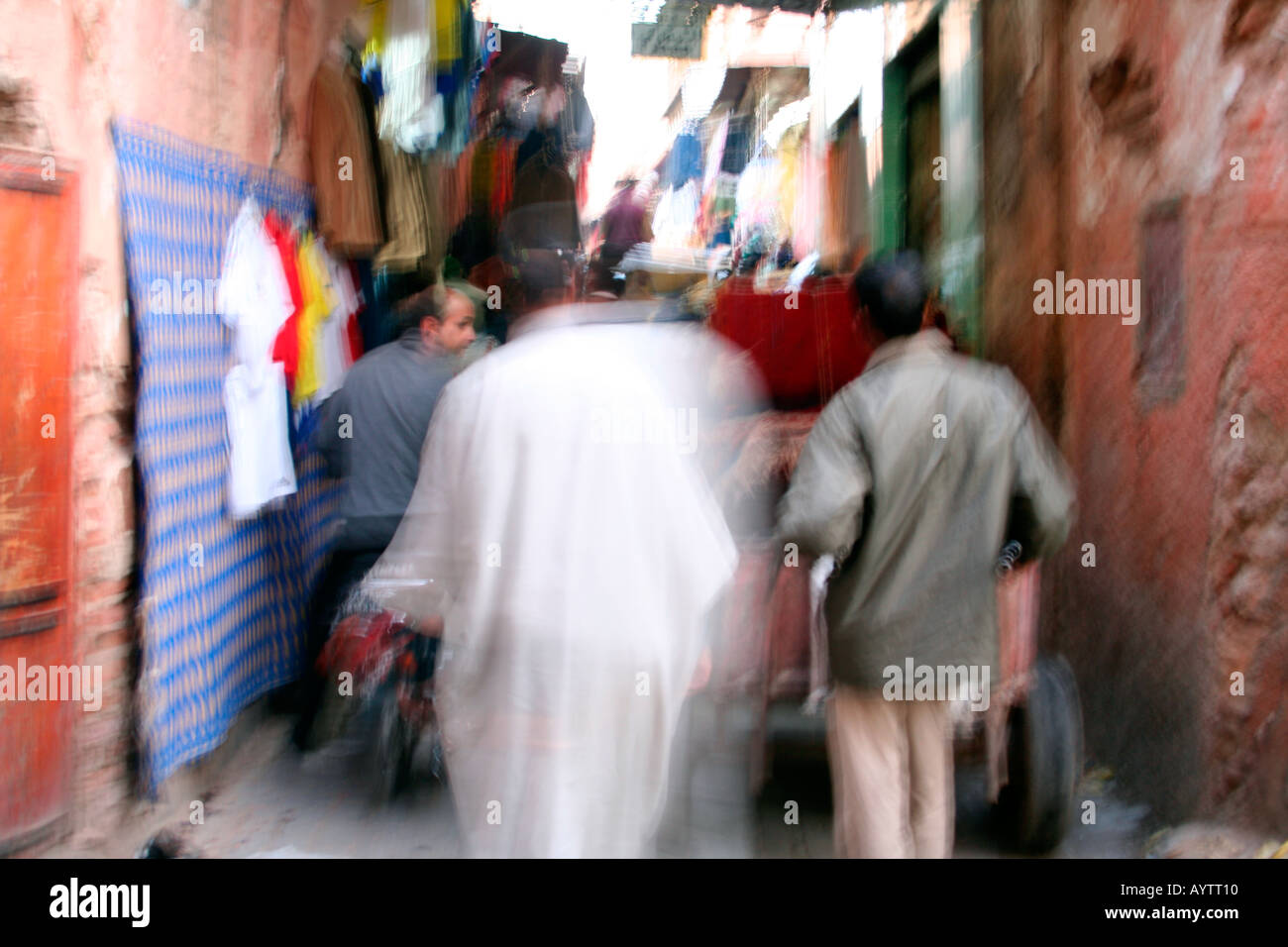 Busy alley behind a donkey and cart traffic jam in the souk, Marrakech ...