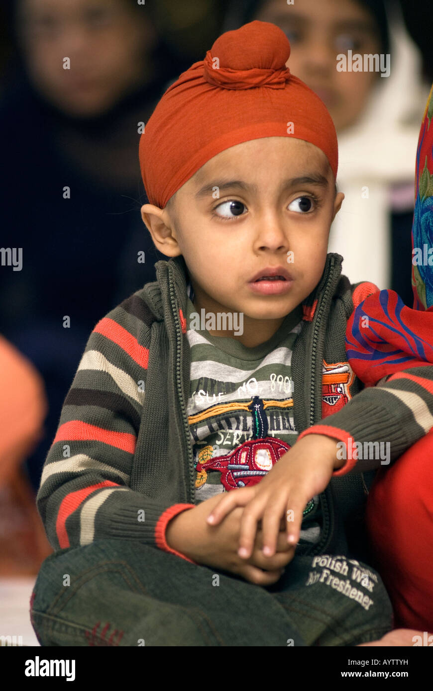 Young Sikh boy in gurdwara or temple on the festival of Vaisakhi Sri ...