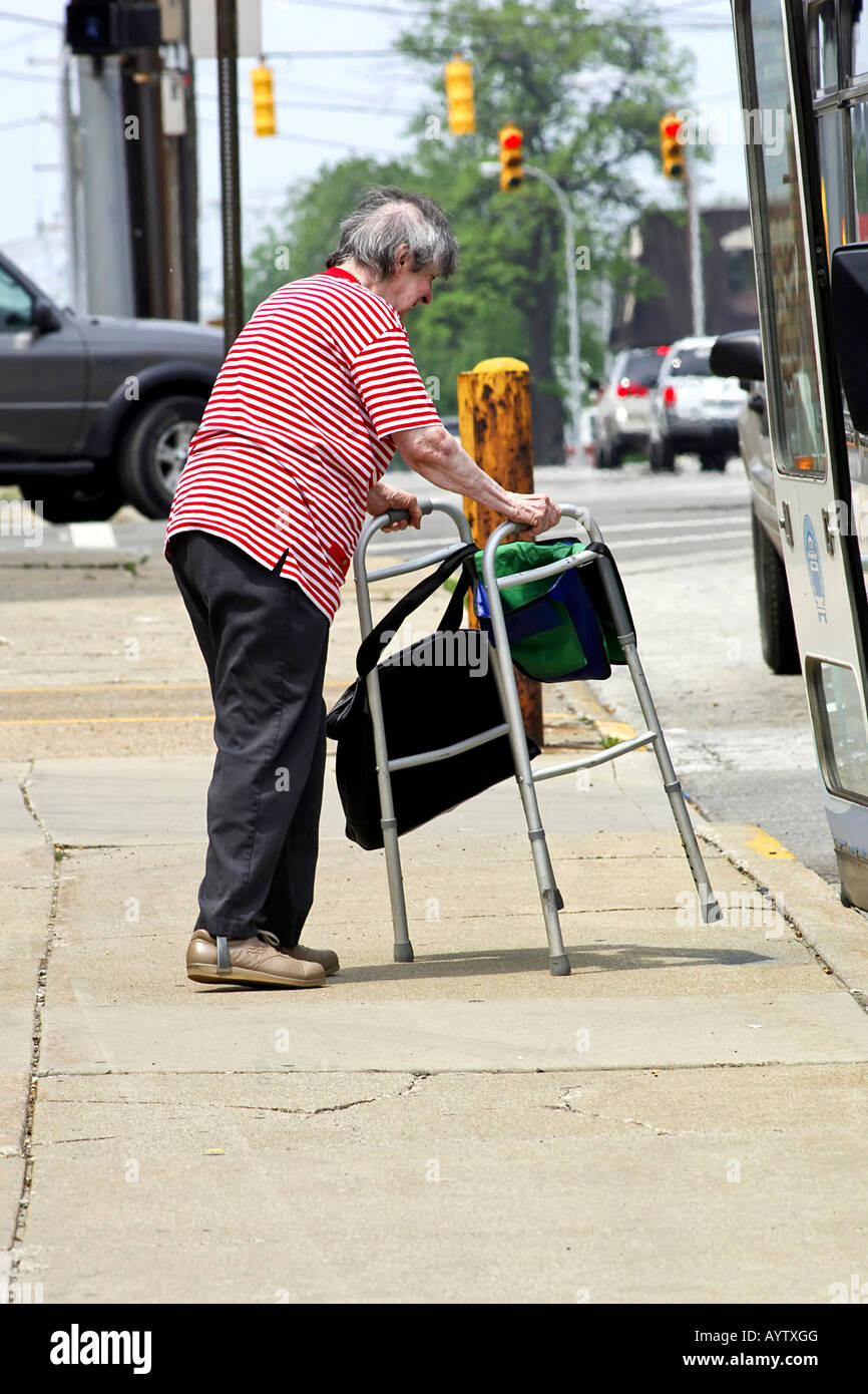 Senior female using a walking frame on the streets of Pittsburgh ...