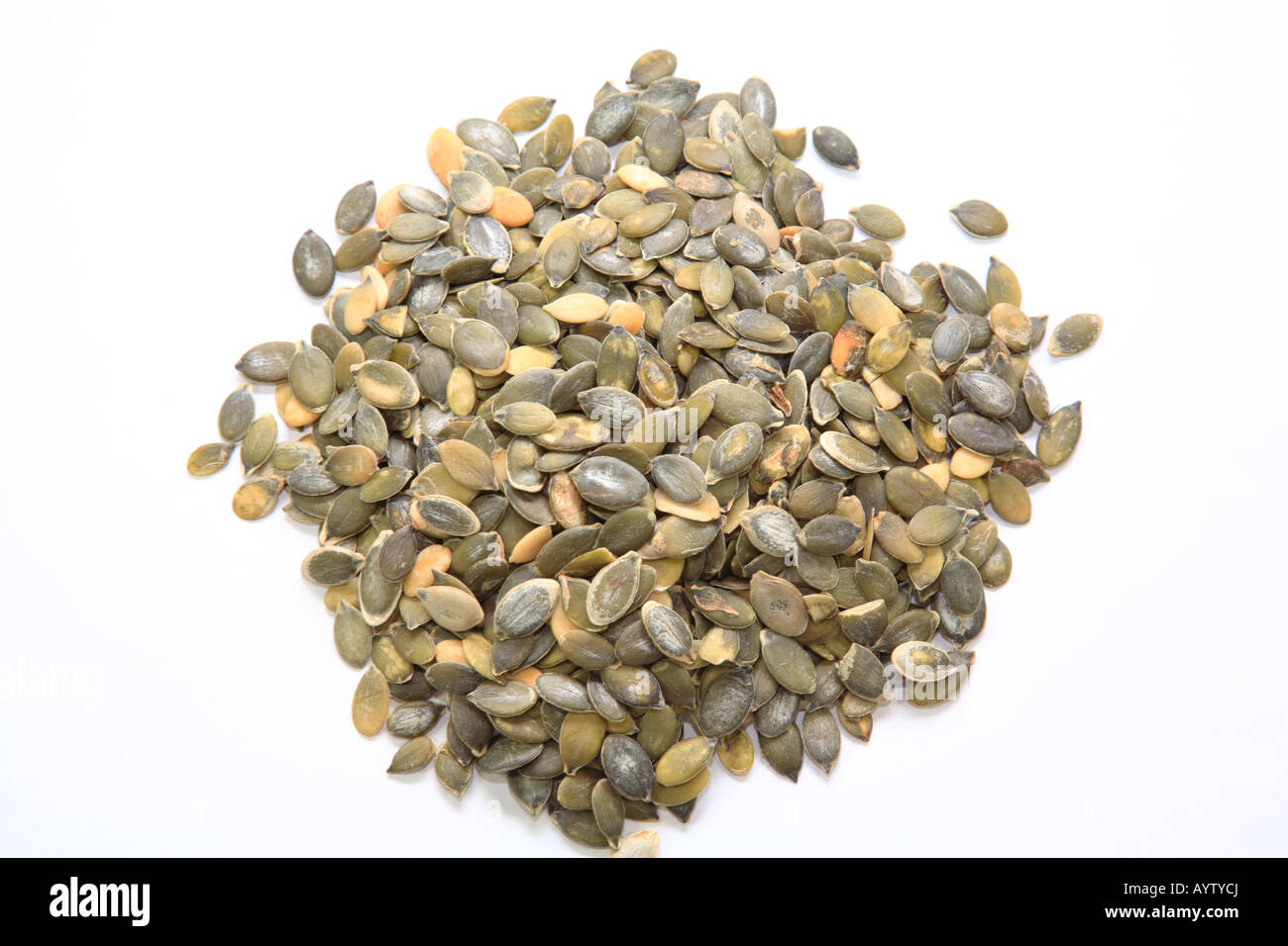 A heap of pumpkin seeds on a white background Stock Photo - Alamy