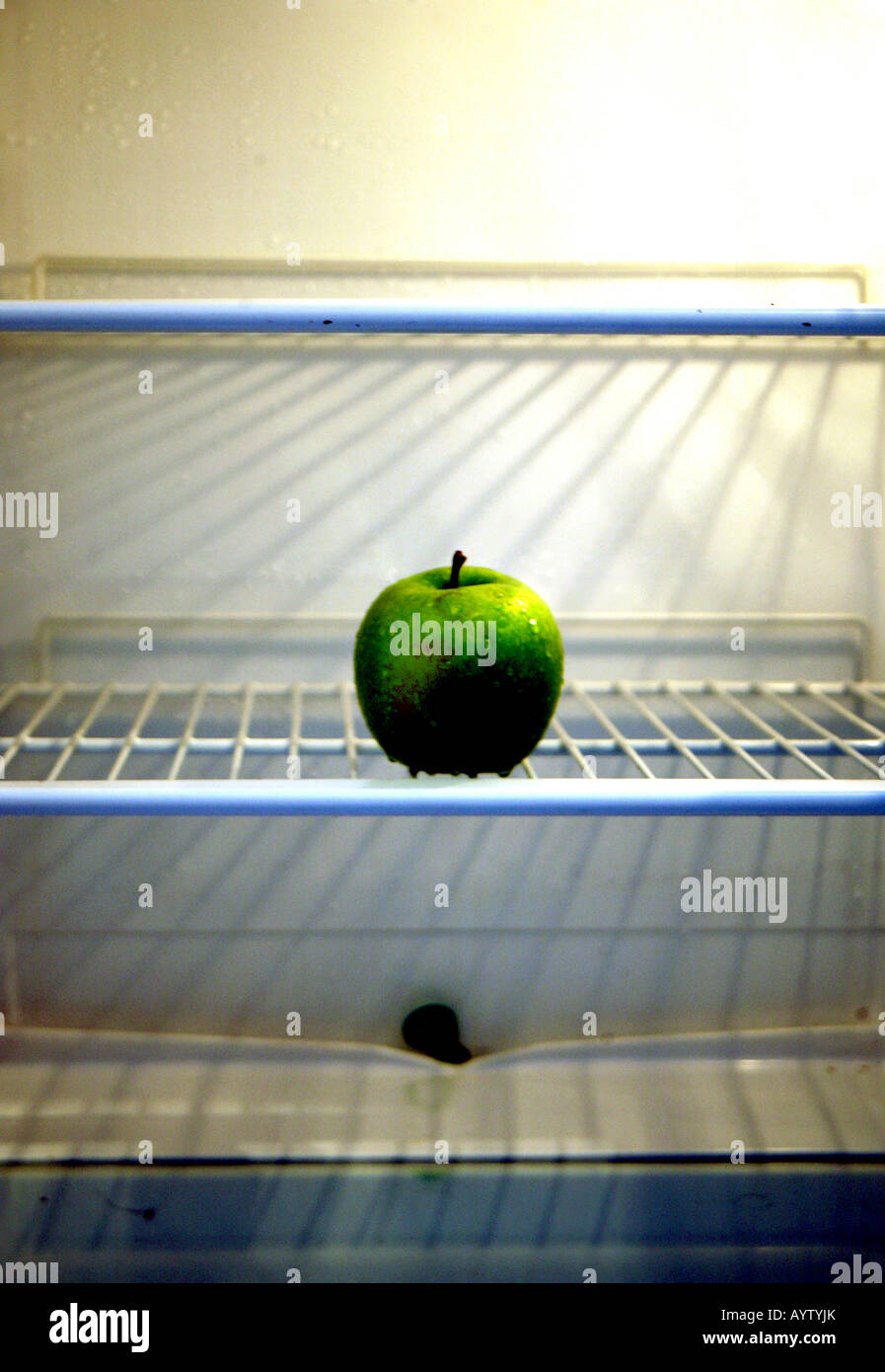 Fridge containing just an apple Stock Photo - Alamy