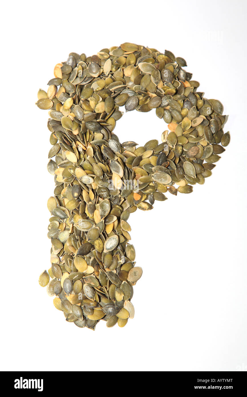 The letter P made up from pumpkin seeds on a white background Stock ...