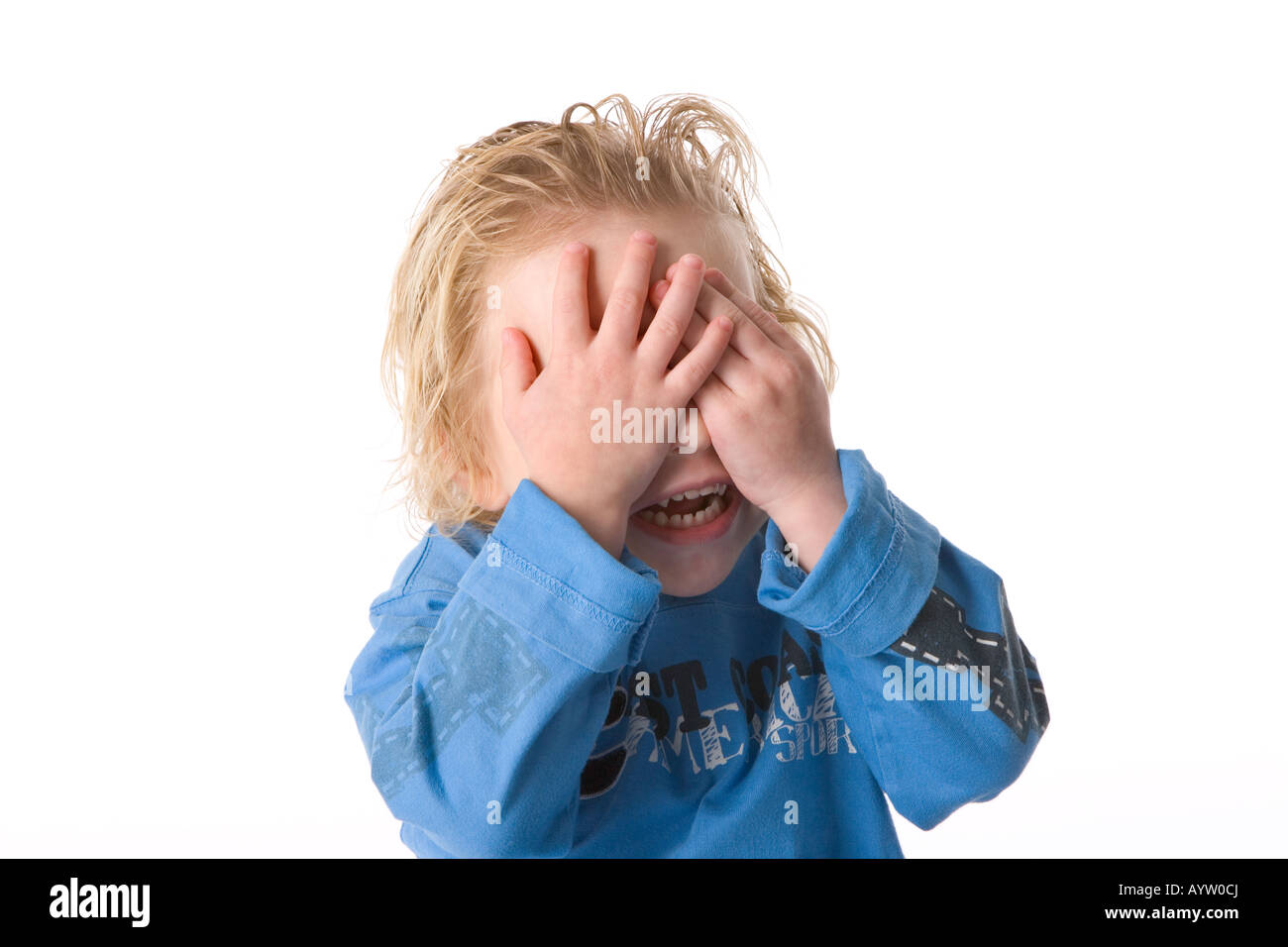 Little boy is hiding behind his hands Stock Photo - Alamy