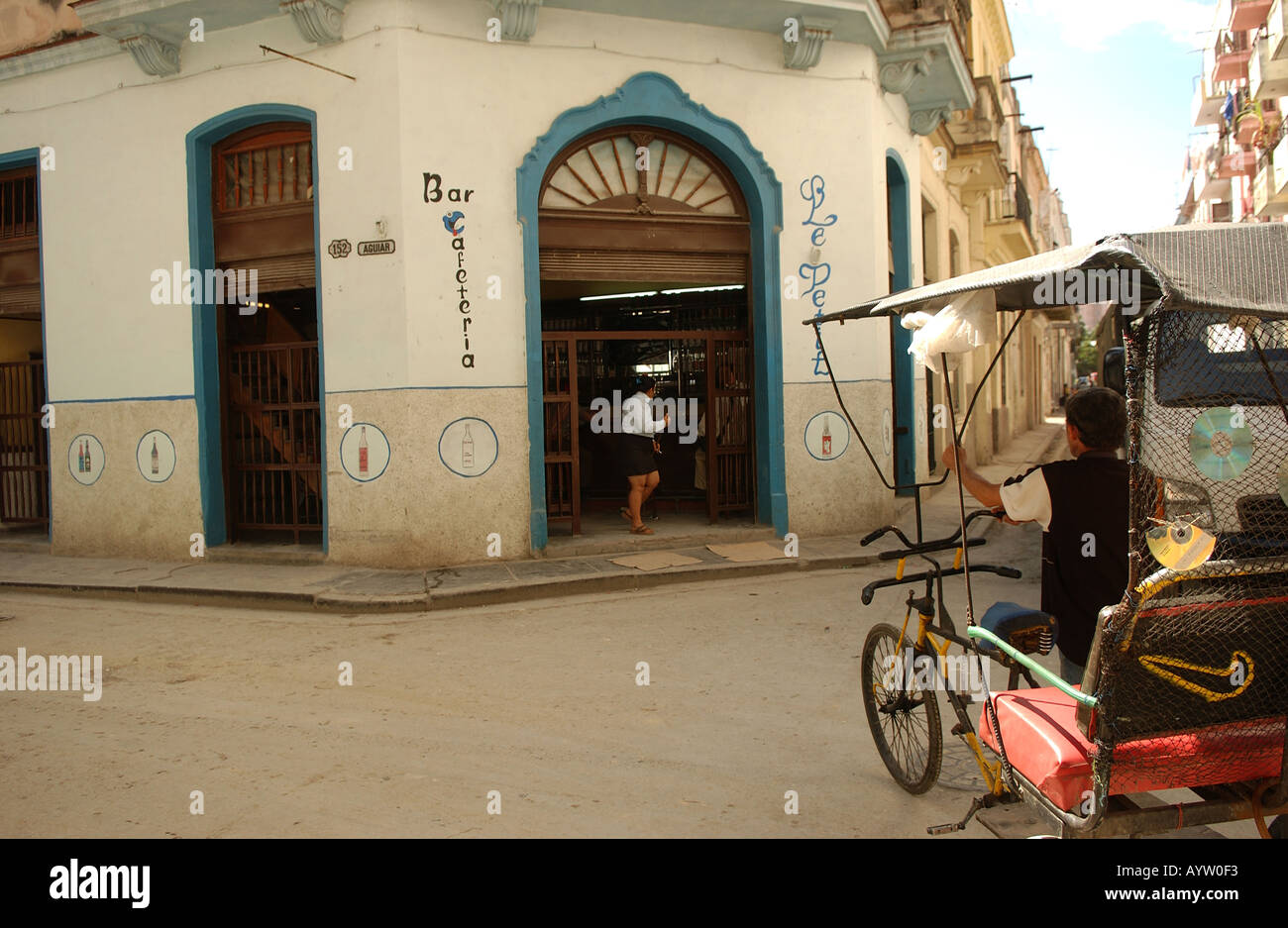 Pedicab parked front of a building structure Havana Cuba Stock Photo ...