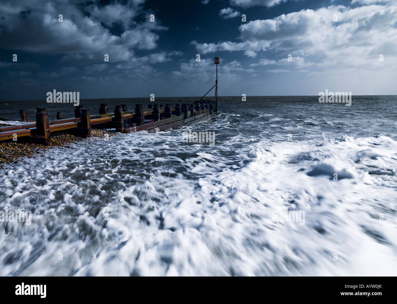 shorebreak with breakwater Stock Photo - Alamy