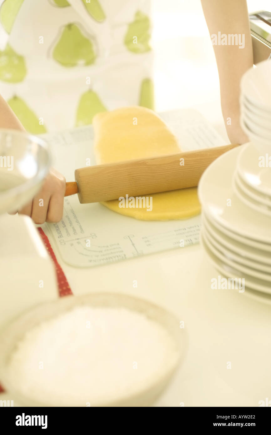 Hands rolling a pin Stock Photo - Alamy