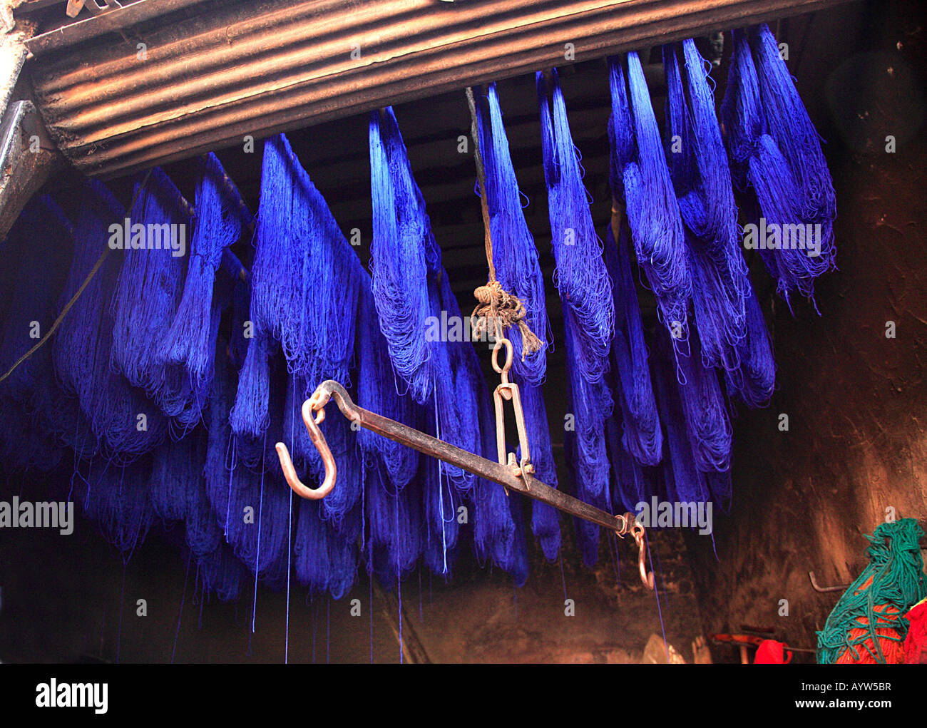 Drying blue dyed wool hung on a rack Morocco North Africa Stock Photo ...