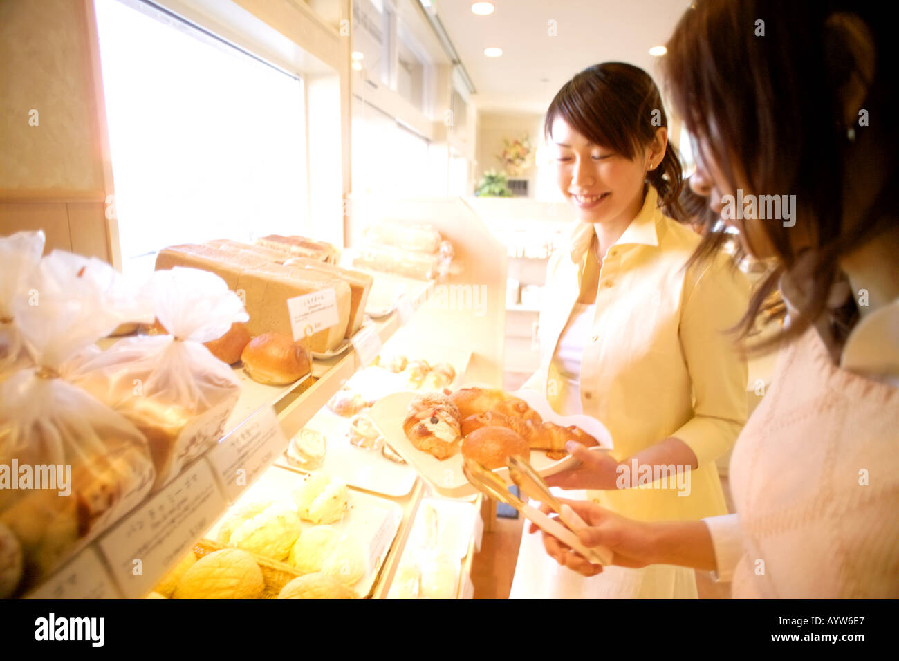 Two women laughing bread hi-res stock photography and images - Alamy