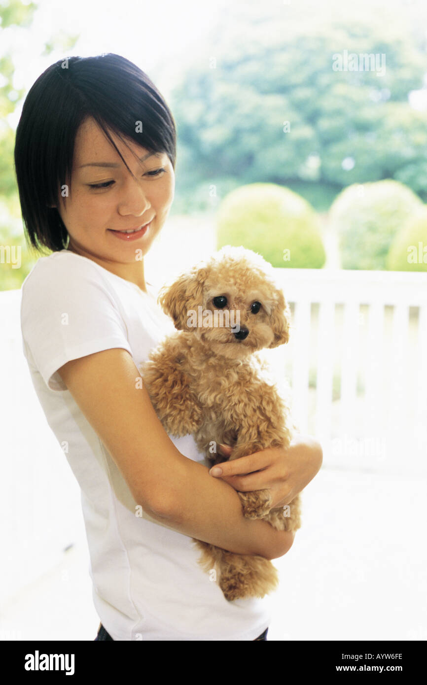 Smiling woman hugging poodle hi-res stock photography and images - Alamy