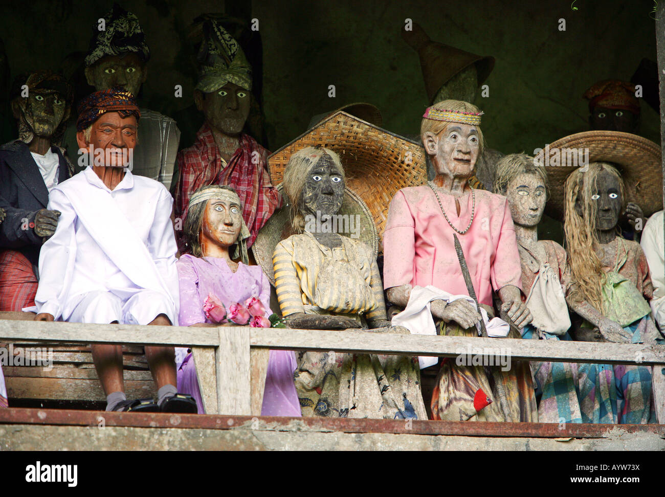 Indonesia: wooden funeral effiges (Tau Tau) at the cliff thombs of ...