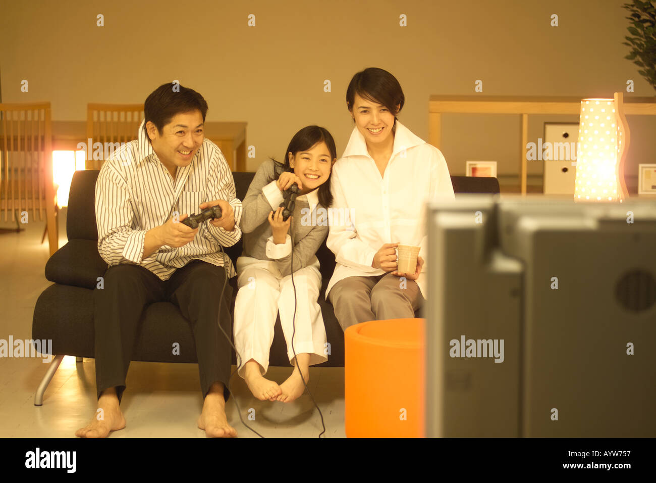 Family playing computer game Stock Photo - Alamy