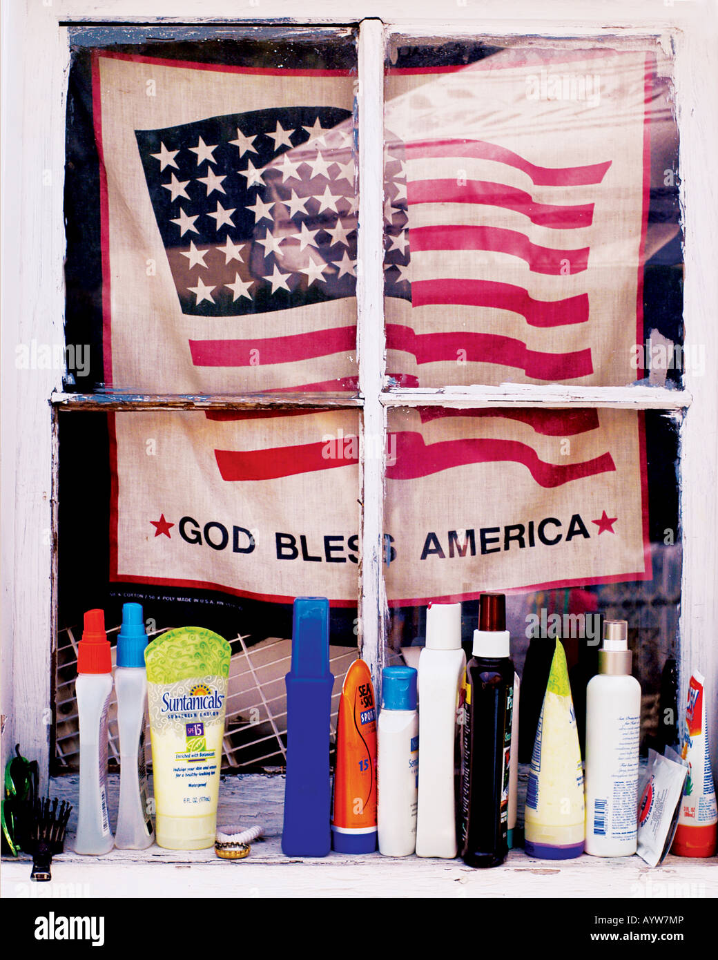 American Flag behind window with multiple summer products on window ...