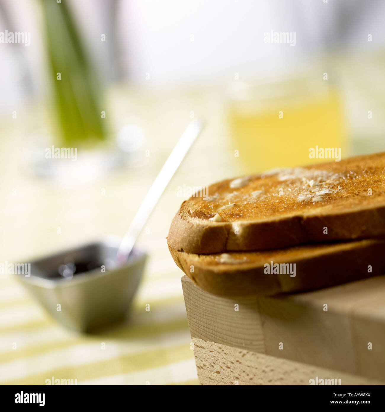 Toasted bread and butter with jam in the bachground Stock Photo - Alamy
