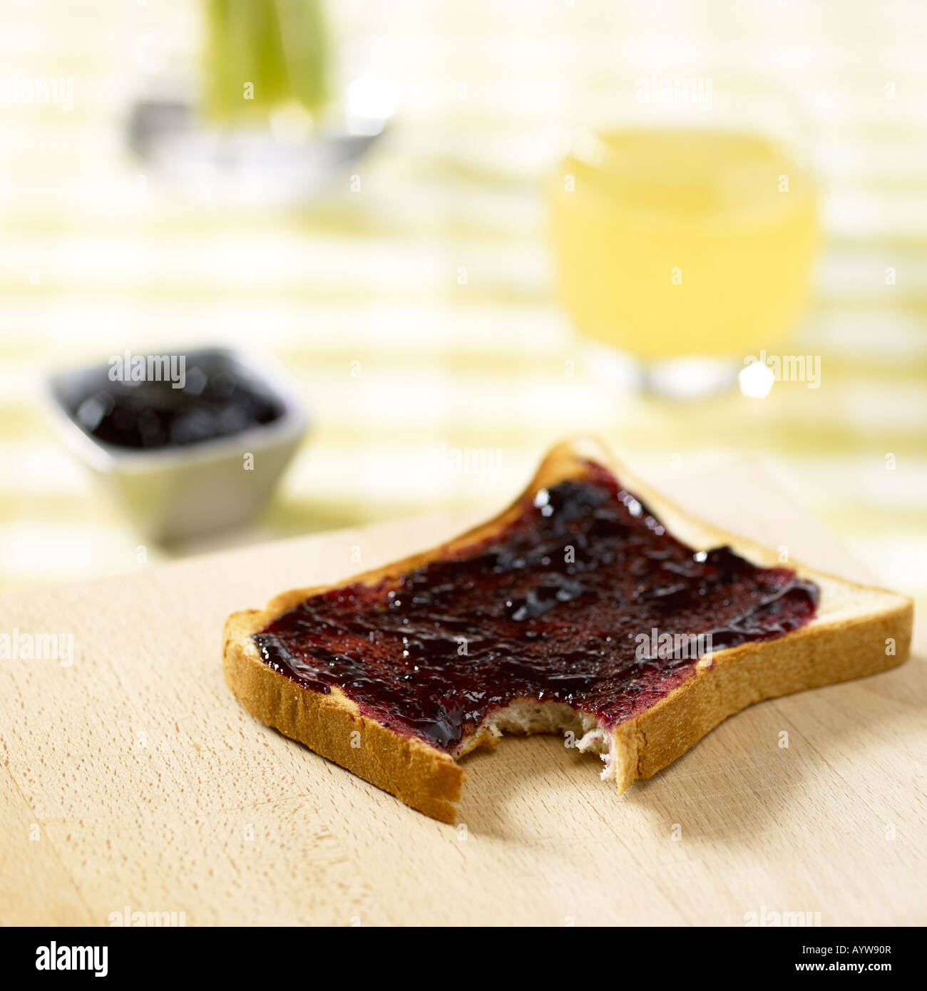 Toasted bread and butter with jam in the bachground Stock Photo - Alamy