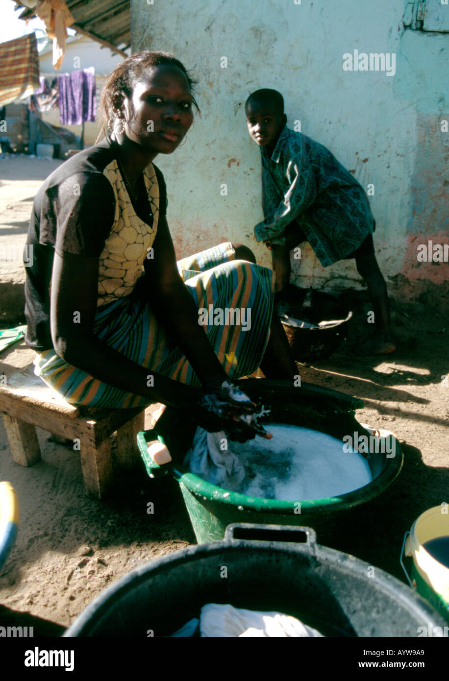 Family living in poverty wash clothes hi-res stock photography and ...