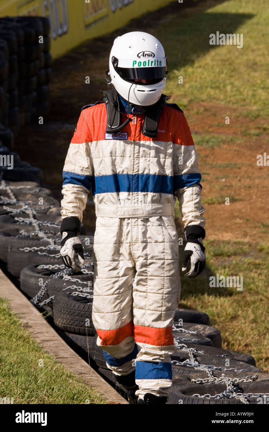 A racing car driver in his driving clothing Stock Photo - Alamy