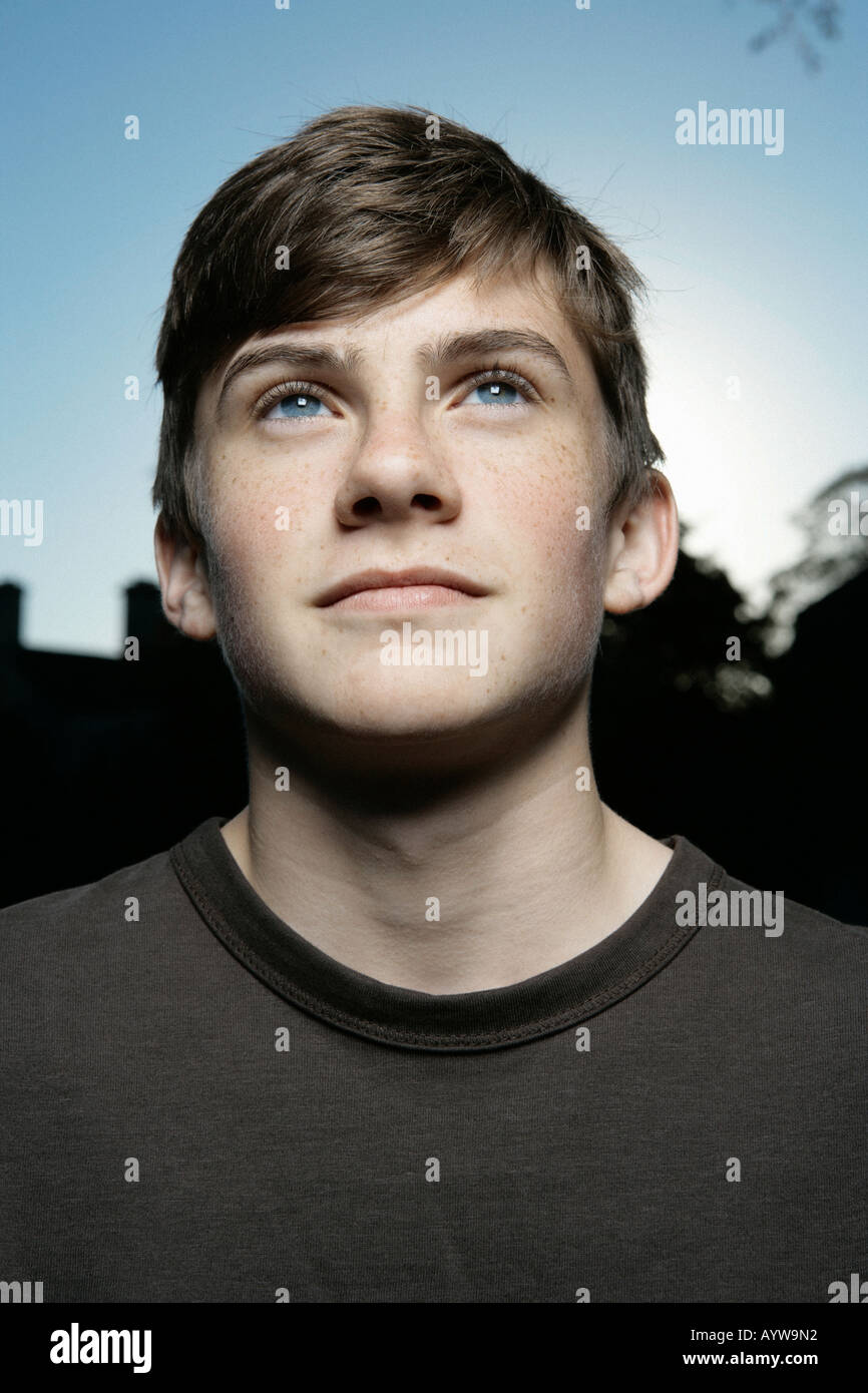 Portrait of a boy looking towards the sky Stock Photo - Alamy