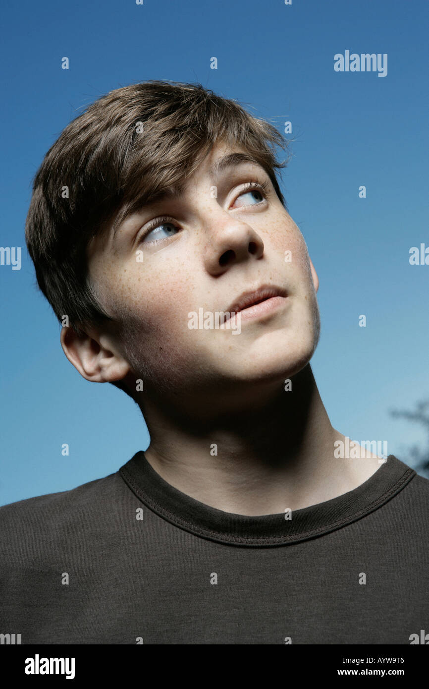 Portrait of a boy tilting his head towards the sky Stock Photo - Alamy