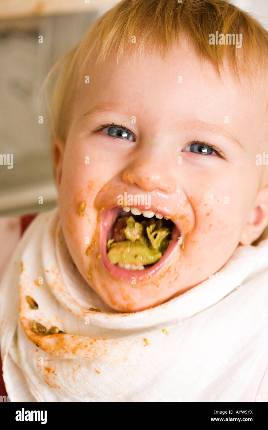 Portrait of toddler eating Stock Photo - Alamy