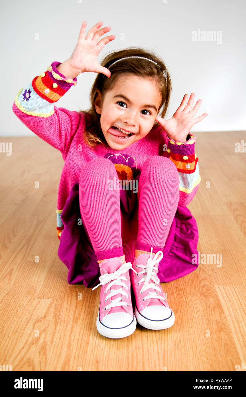 adorable little girl making funny faces Stock Photo - Alamy