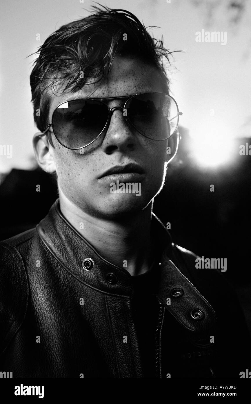 Black and white photograph of a rockerbilly posing with sunglasses ...