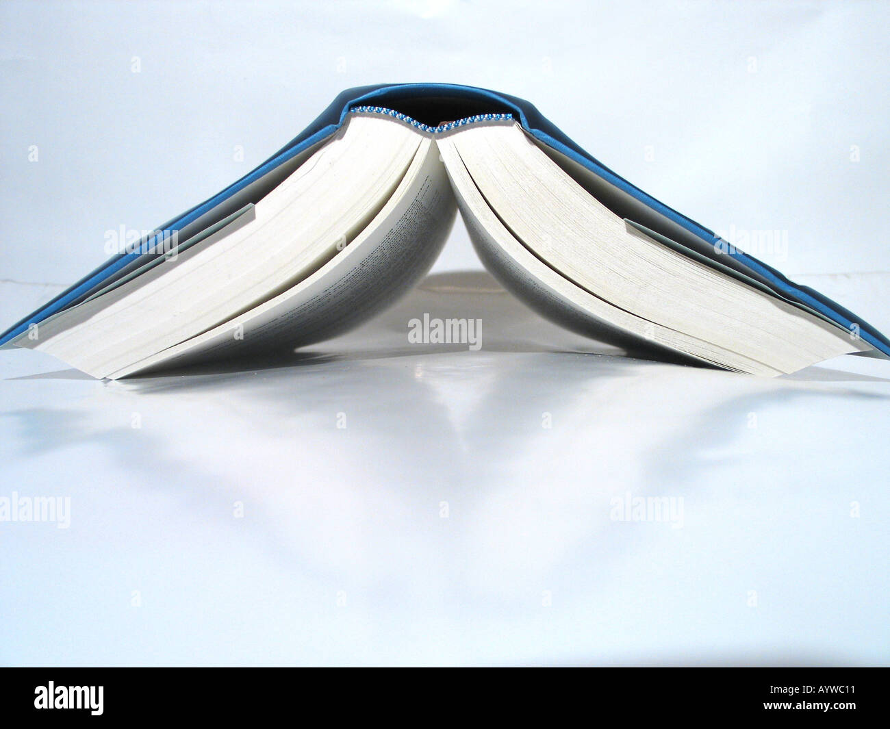 Opened book face down Stock Photo - Alamy