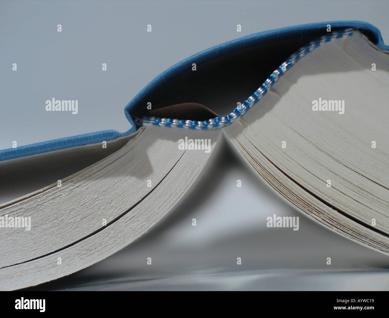 Opened book face down Stock Photo - Alamy