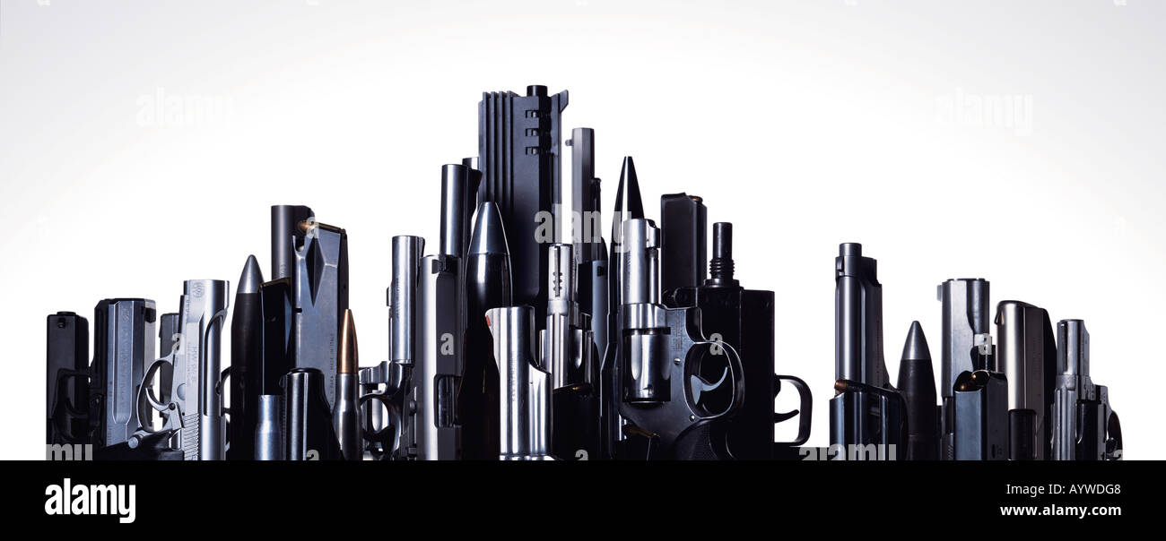 A city skyline made up of many different types of hand guns, clips and ...